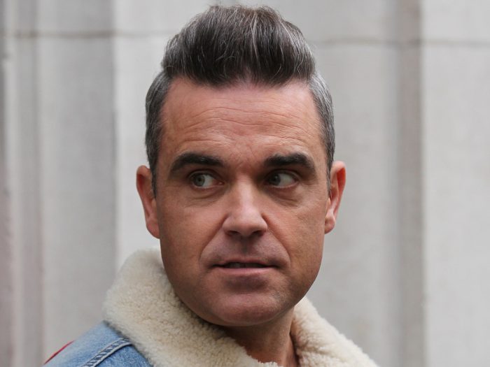 New "lockdown look": Robbie Williams shaves his bald head - Law & Crime ...